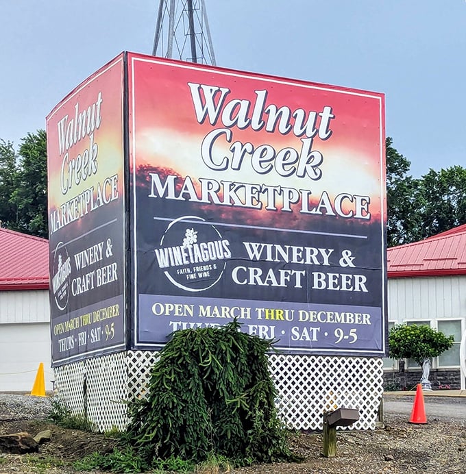 The beacon of bargain hunting! This sign not only guides you to shopping paradise but also to wine tastings Winery&mdash;because shopping is thirsty work.