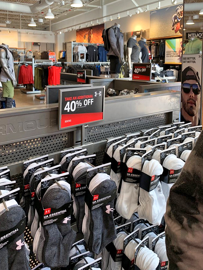 Under Armour socks stacked in neat rows promise comfort for feet that deserve better than whatever's currently in your drawer.