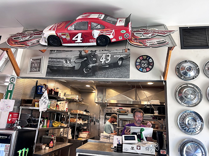 Where racing memorabilia meets short-order magic. The kitchen view offers a glimpse of where the rubber meets the road&mdash;or where the spatula meets the grill.