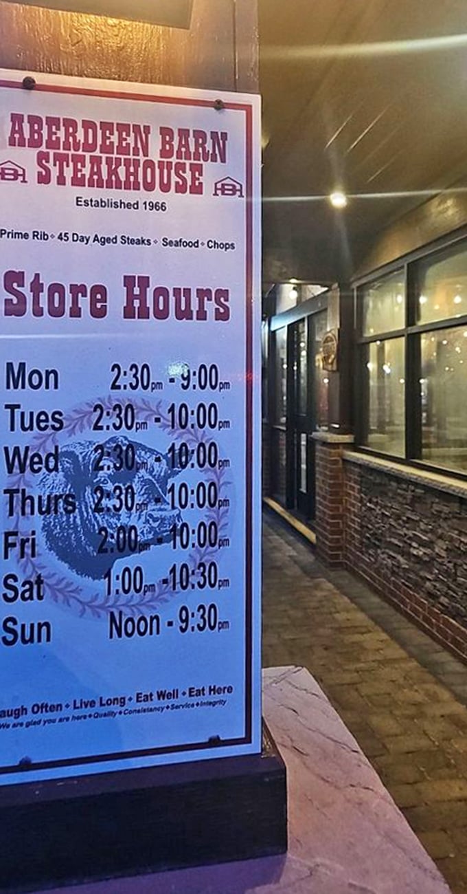 Store hours posted like a promise: "We'll be here when hunger strikes, except unreasonably early Monday mornings."