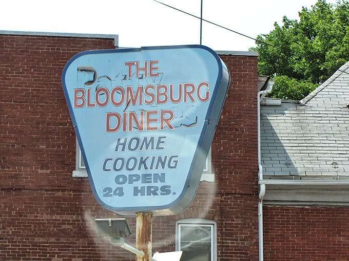 That vintage sign has weathered decades, promising "Home Cooking" 24 hours a day &ndash; a vow as American as the flag nearby.