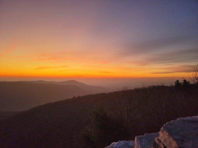 Sunset paints the valleys in gold and crimson, making you glad you stayed past the afternoon crowd.