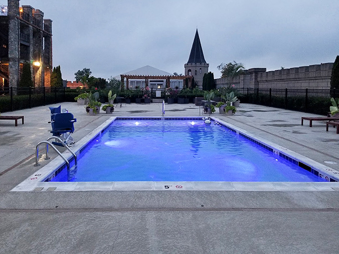 The castle's rooftop pool glows an ethereal blue at dusk, turning an ordinary swim into a royal experience under the stars.