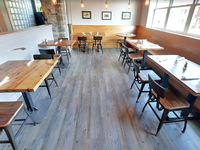 Simple wooden tables await their moment to shine as platforms for barbecue greatness &ndash; no white tablecloths needed when the food is this good.