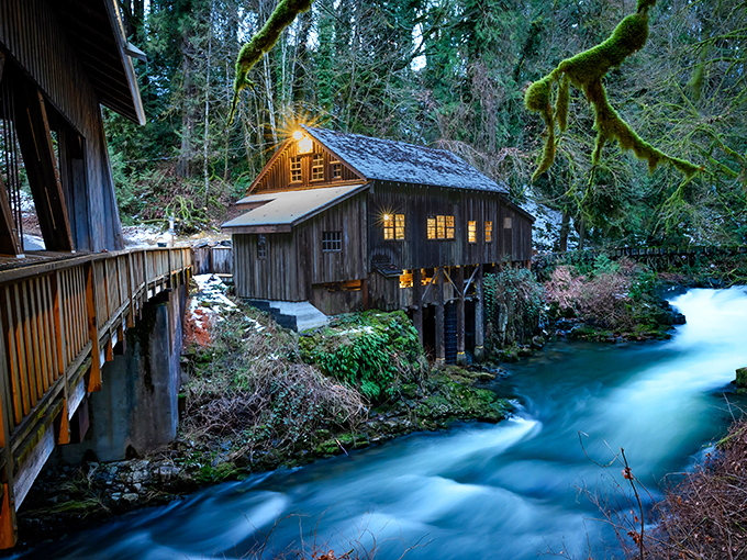 The evening glow transforms the mill into something from a fairy tale, with Cedar Creek providing the perfect flowing soundtrack.