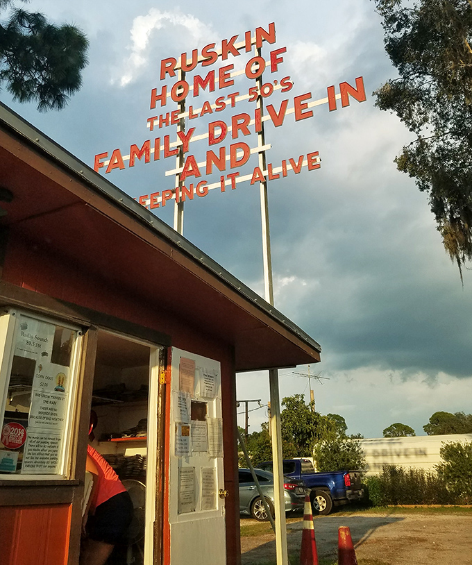 The ticket booth stands as a cheerful gatekeeper to cinematic adventures, topped with that unmistakable retro signage that's become Ruskin's calling card.