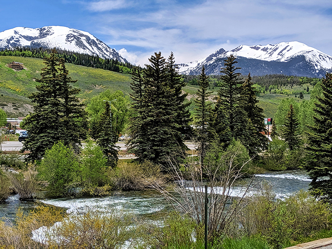 Beyond the shopping &ndash; the Blue River and snow-capped peaks remind you that nature's best deals require no credit card.