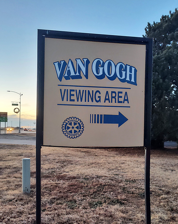 The sign points the way with Rotary Club pride. Without it, you might mistake this for just another giant painting on an enormous easel in rural Kansas.