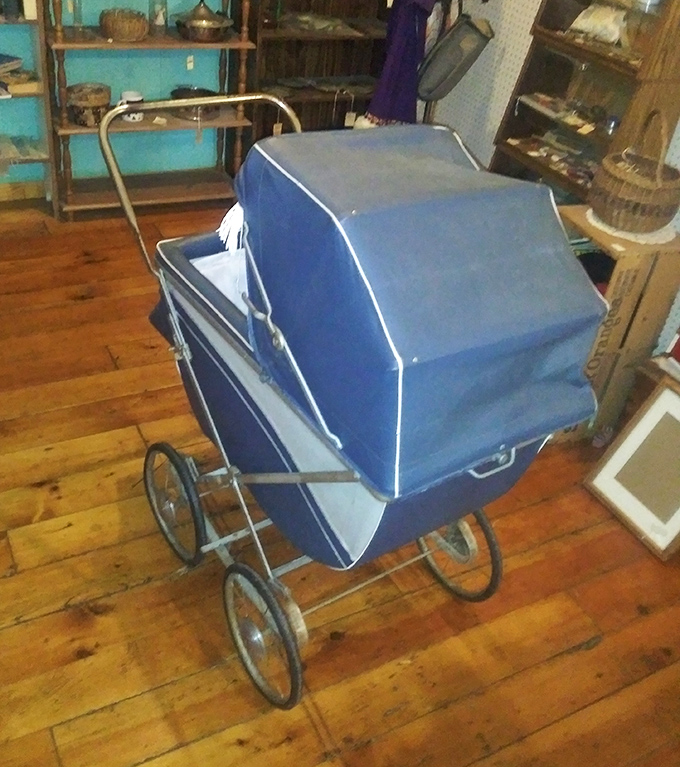 This vintage baby carriage isn't just transportation; it's a time machine that could have rolled straight out of a 1950s family sitcom.