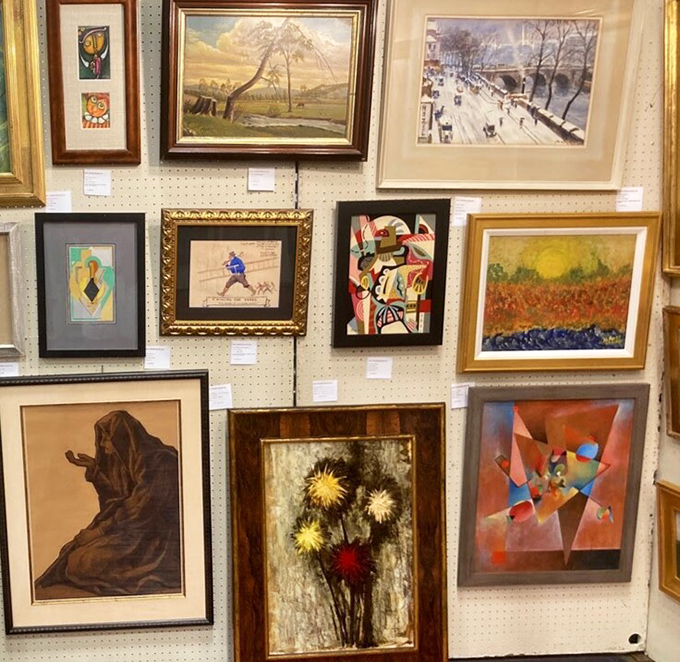 The art wall: where abstract expressionism meets landscapes, and your empty living room wall practically begs for attention.