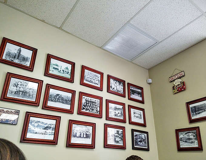 A wall of memories that tells the neighborhood's story. These framed photographs aren't just decoration &ndash; they're a visual history lesson served alongside your eggs.