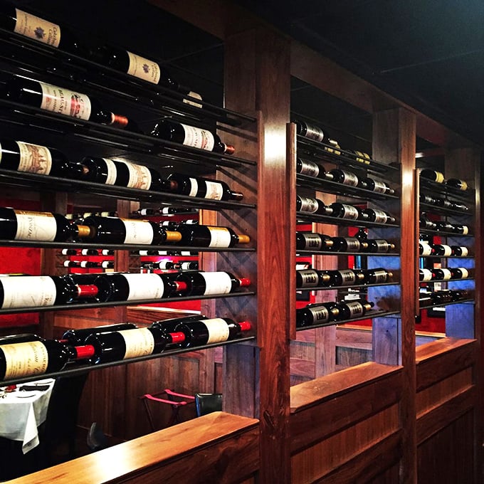 The wine display showcases bottles like trophies &ndash; each one waiting for its moment to complement the perfect steak.