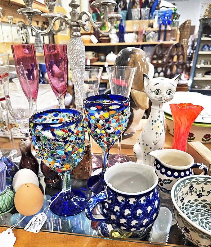 Colorful glassware that transforms ordinary wine into a special occasion. That cat figurine seems to be judging your beverage choices.