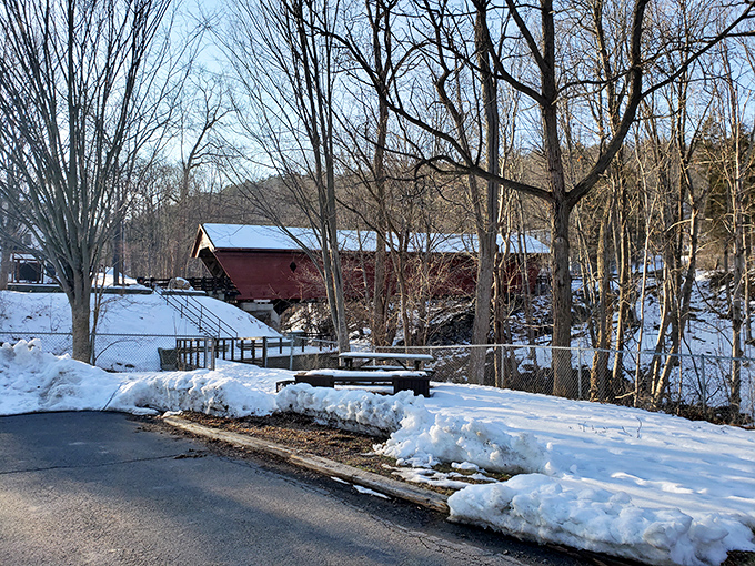 Winter transforms the bridge into a scene worthy of a holiday card. The red siding against pristine snow creates a contrast that photographers dream about.