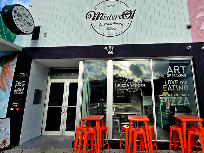 Mister O1's sleek storefront with bright orange stools signals this isn't your grandpa's pizza joint. "Extraordinary" isn't just marketing here.
