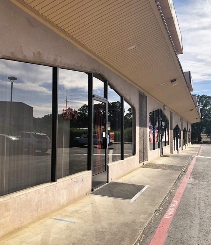 Behind this modest exterior lies a world of hand-pulled noodles and wok-fired treasures.