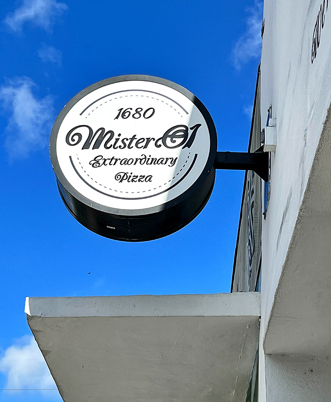The clean, minimalist design of Mister O1 matches their modern approach to pizza. That circular sign promises pizza perfection inside.