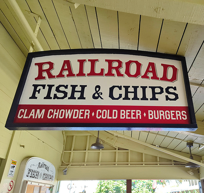 That classic red, white, and blue sign isn't just patriotic—it's a beacon calling all hungry travelers to Railroad's legendary fish and chips.
