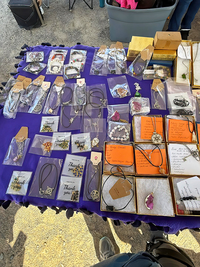 Jewelry displayed with care on purple velvet. Each pendant and bracelet waits to become someone's "lucky find" story at dinner parties.