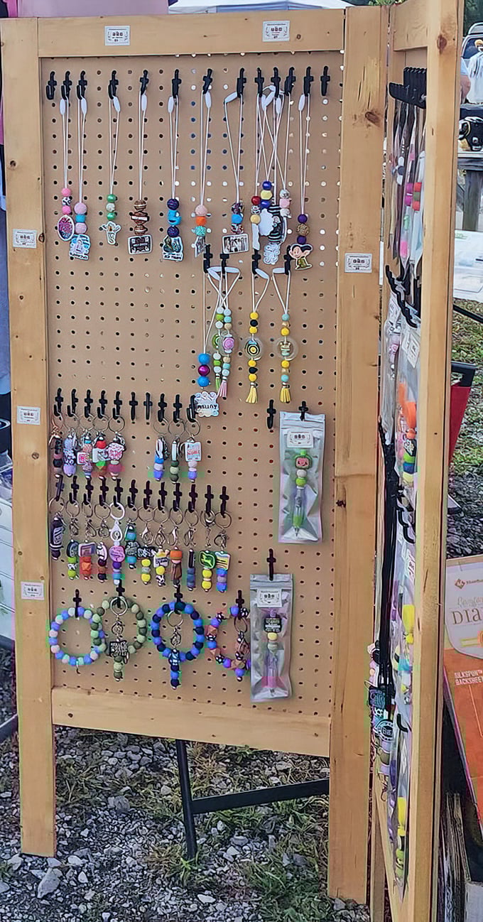 Handmade beaded accessories on pegboard showing more creativity than most department stores manage with entire merchandising teams.