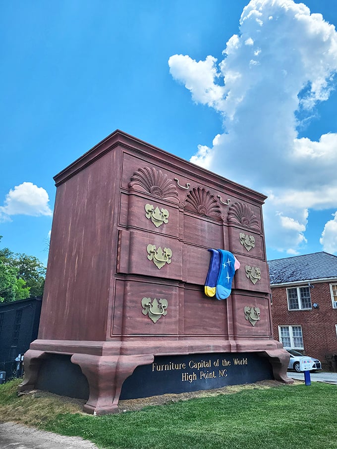 Blue skies provide the perfect backdrop for this rich brown monument to furniture craftsmanship. The colorful sock adds that perfect touch of whimsy.