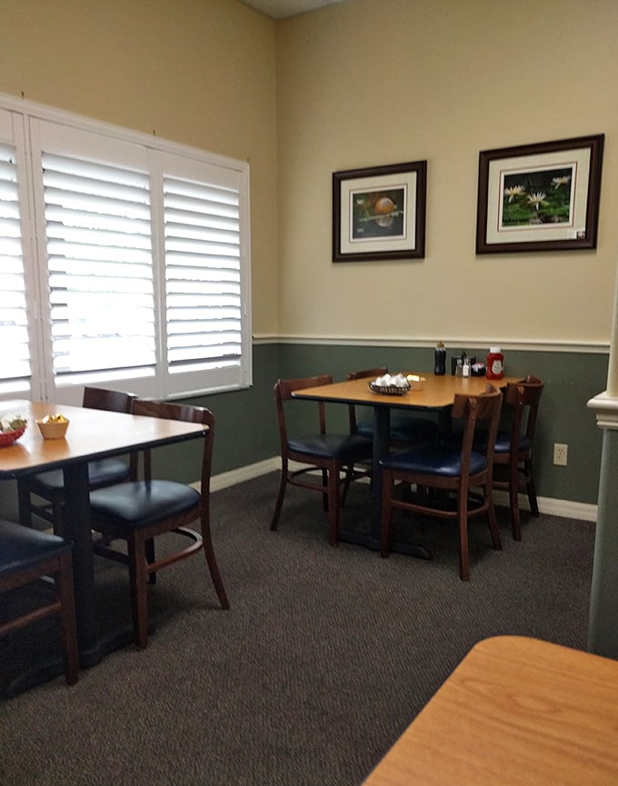 Corner tables bathed in natural light through plantation shutters&mdash;the perfect setting for savoring that second cup while planning your day.