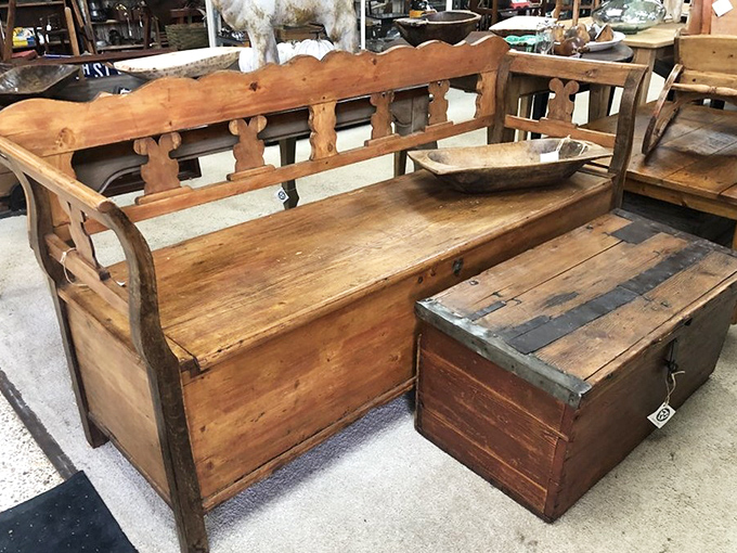 Conversation piece meets practical seating. This antique bench has heard more family secrets than your therapist and looks better with age.