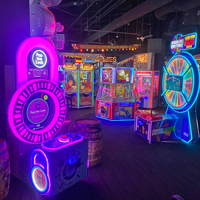 The neon wonderland of arcade games where quarters disappear faster than your resolution to "just play one game."