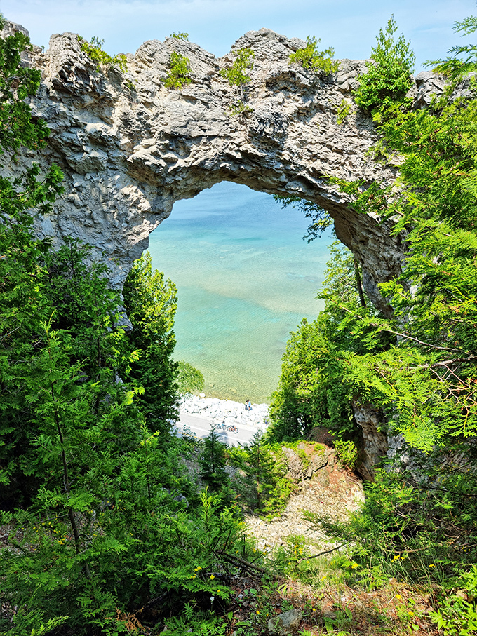 Nature's perfect picture frame&mdash;Arch Rock dramatically frames the turquoise waters of Lake Huron, creating the island's most photographed natural wonder.