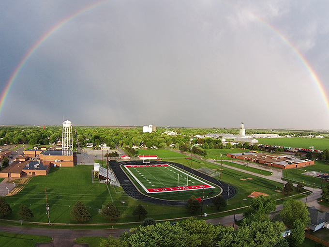A rainbow arches over Aurora's sports complex, nature's way of saying even the weather approves of this affordable slice of Midwestern paradise.