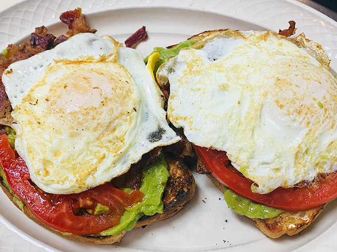 Avocado toast that proves this place respects both tradition and trends. Those eggs are sunshine on a plate.
