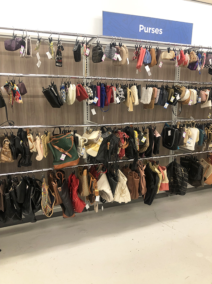 The handbag wall&mdash;where designer dreams and practical purses hang together in democratic fashion harmony.