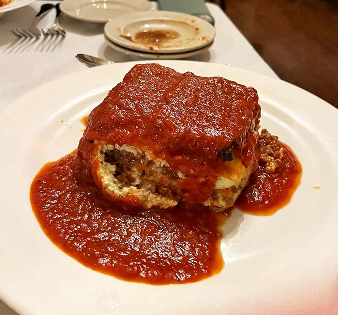 This isn't just lasagna; it's a geological marvel with layers of pasta, cheese, and sauce that archaeologists of appetite will happily excavate until nothing remains.