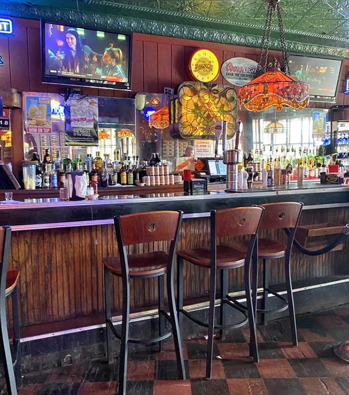 The bar area combines old-school charm with modern comforts. Those stained glass lamps have witnessed countless toasts and "remember when" stories.