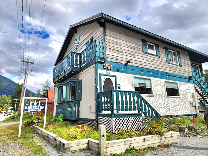Basecamp's blue balconies and mountain backdrop offer a European alpine aesthetic with distinctly Alaskan hospitality.