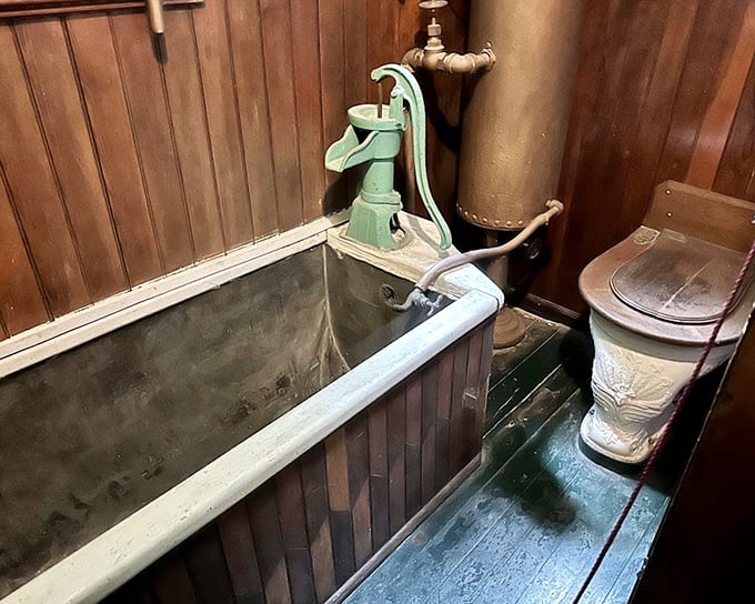 The bathroom's hand pump reminds us that indoor plumbing was once revolutionary technology. Suddenly your water pressure complaints seem trivial.