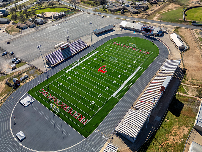 Friday night lights shine bright on fields where small-town dreams take flight weekly.