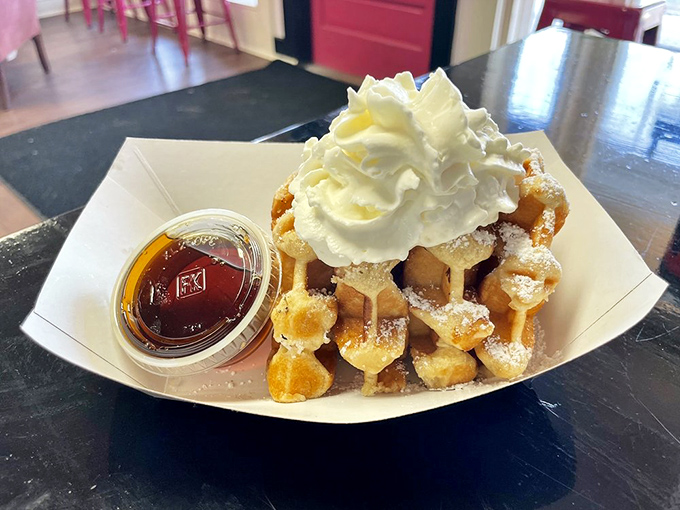 These Belgian waffles aren't just breakfast—they're a fluffy, golden platform for whipped cream and maple syrup to perform their sweet magic.