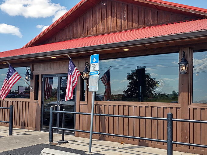American flags frame this wooden fa&ccedil;ade like patriotic bookends, promising the kind of BBQ that makes you proud to be an American.