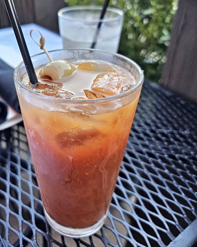 This isn't just a Bloody Mary; it's a spicy, ice-cold work of art garnished with olives that's begging to kick your weekend brunch into high gear.