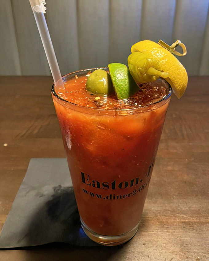 A Bloody Mary garnished with enough citrus to ward off scurvy. The kind of drink that counts as both beverage and appetizer.