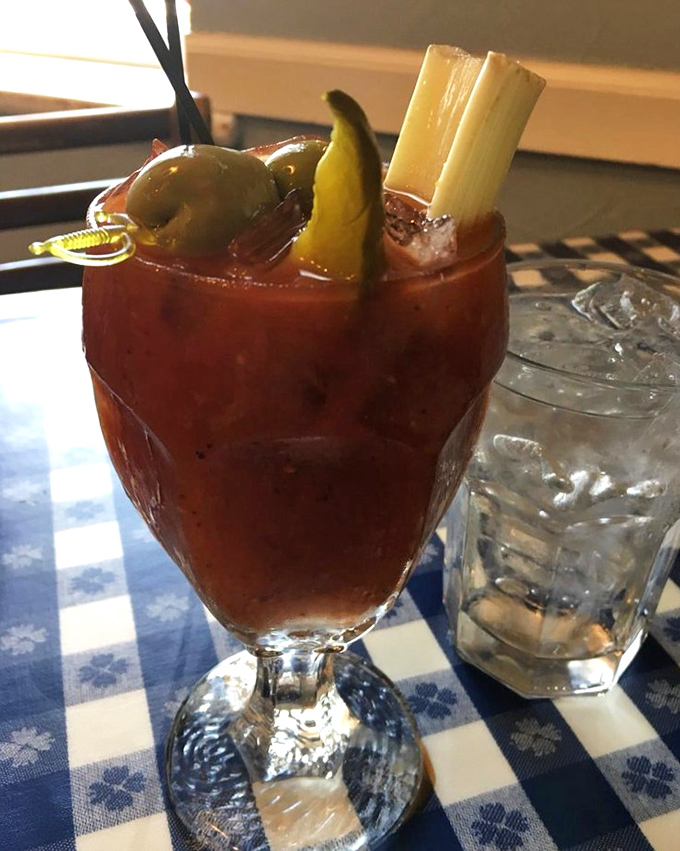 A Bloody Mary garnished with such conviction it's practically a small meal. That celery stalk isn't just garnish&mdash;it's structural support.