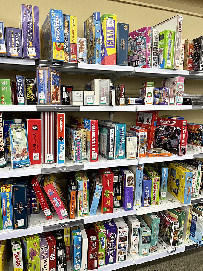 Family game night headquarters! These shelves hold countless evenings of competitive fun, with barely-opened boxes just waiting for their next players.