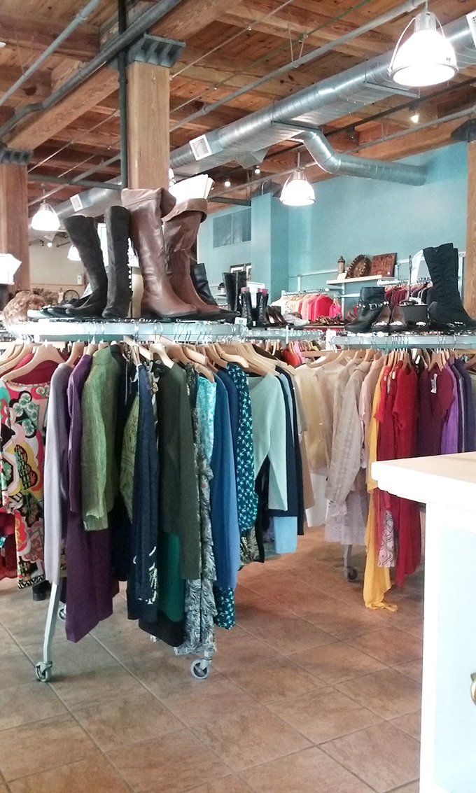 Boots on parade above a rainbow of blouses&mdash;proof that at Retique, fashion literally operates on multiple levels.