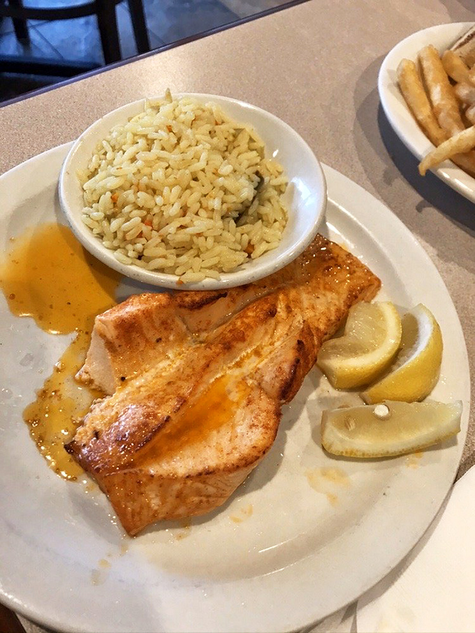Broiled salmon that proves diner seafood can be both simple and spectacular, with perfectly fluffy rice alongside.