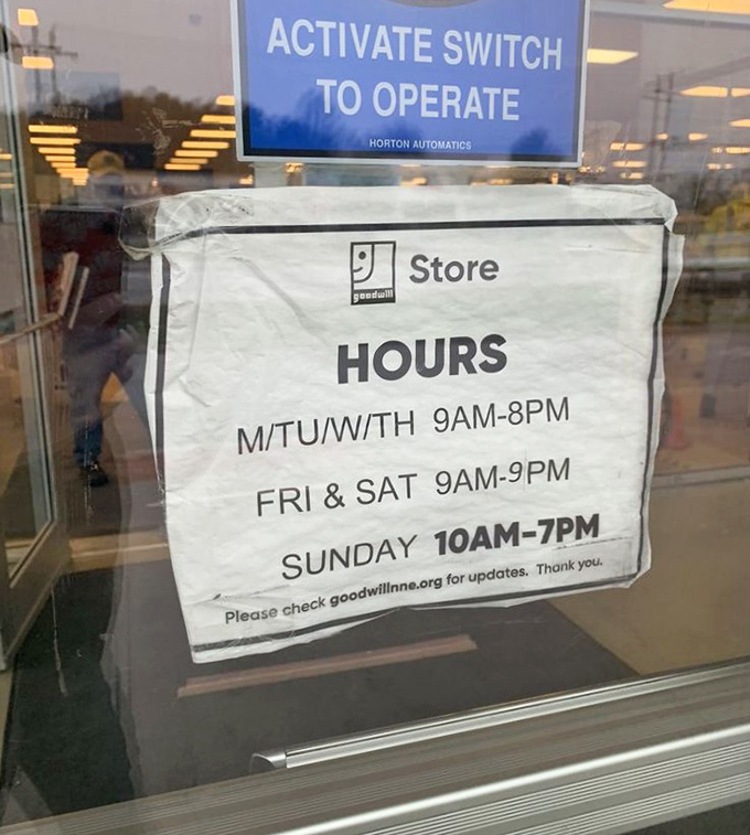 Store hours posted clearly&mdash;the roadmap to planning your thrifting adventures at this Portsmouth secondhand paradise.