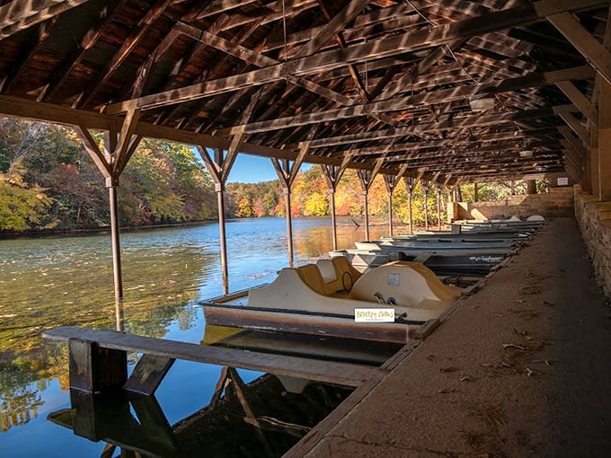 The boathouse in autumn looks like it's been waiting all year for this moment&mdash;when the water mirrors the fiery trees. 