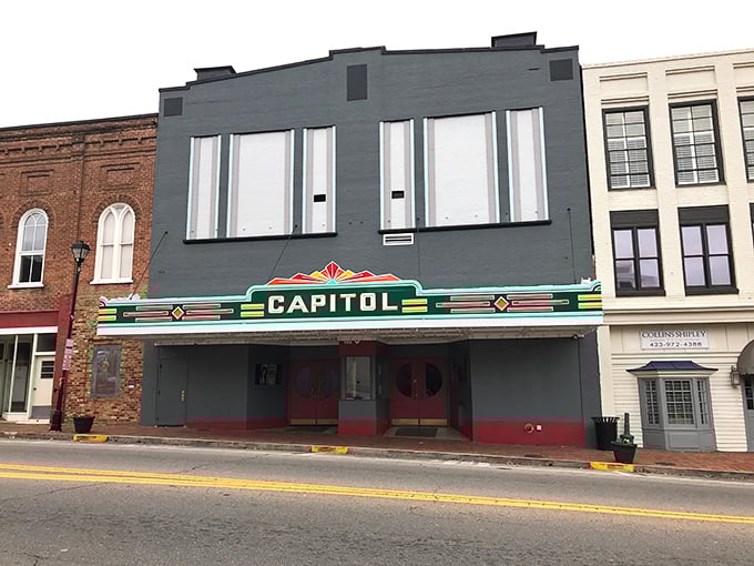 The Capitol Theatre's vintage marquee glows with nostalgic promise. Movies were events when theaters looked like this, not just places to check your phone.