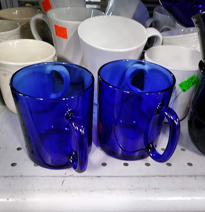 Cobalt blue glass mugs catching light like tiny sapphires&mdash;proof that your morning coffee deserves a dramatic presentation always.