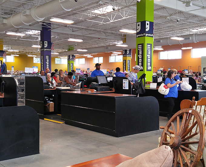 Multiple checkout stations handle the constant flow of victorious bargain hunters carrying their carefully curated finds toward freedom.
